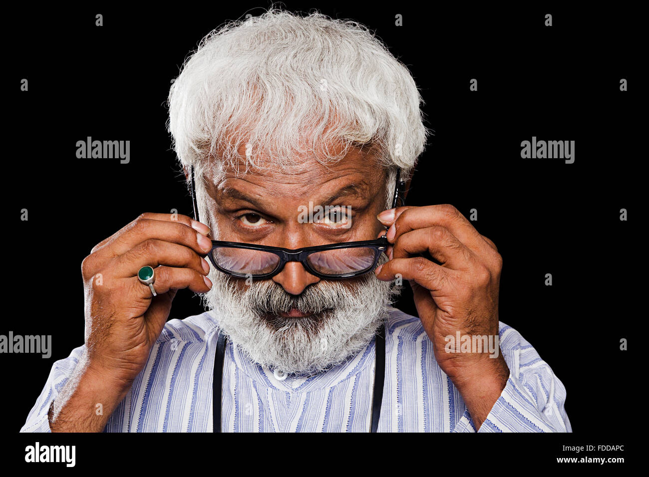 1 indian Senior Adult Man spectacles watching Stock Photo - Alamy