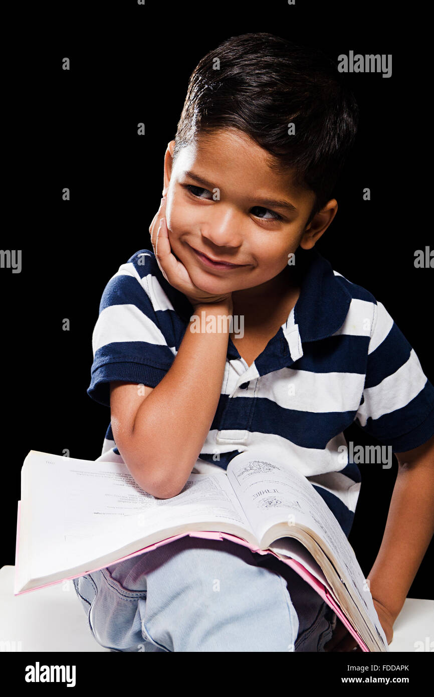 1 indian Kid Boy Student Reading Book Stock Photo - Alamy