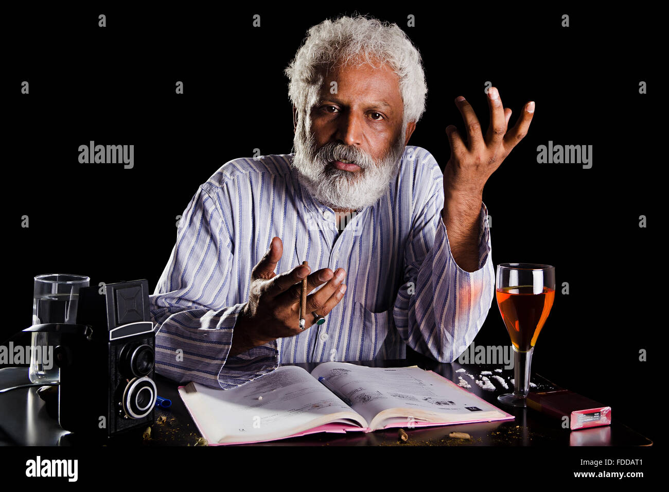 1 indian Senior Adult Man Journalist Book writing Stress smoking ...