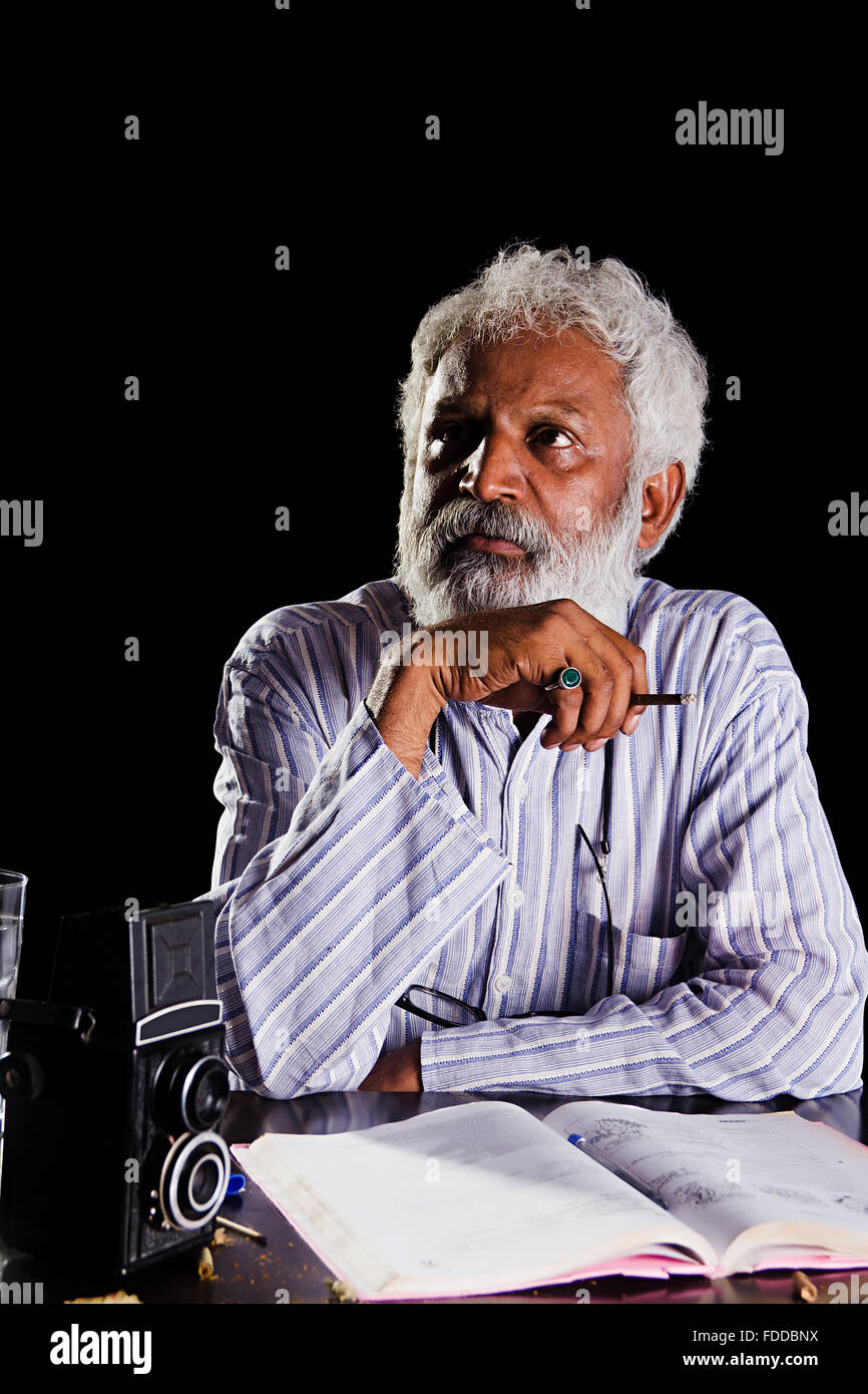 1 indian Senior Adult Man Journalist thinking writing book Stress smoking Cigarette Stock Photo ...
