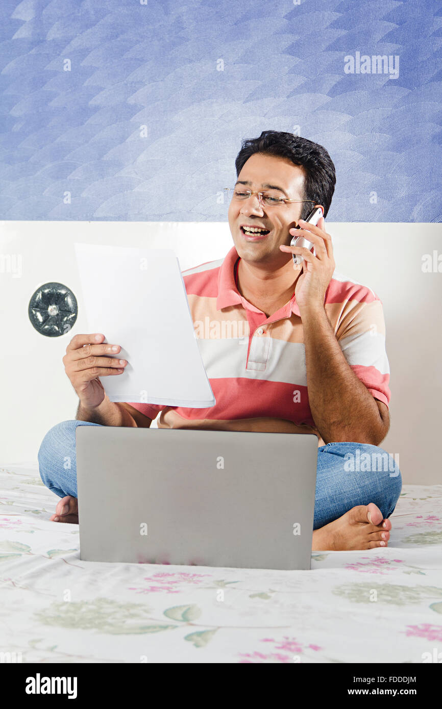 1 Adult Man Papers Checking and Talking Mobile Phone Stock Photo - Alamy