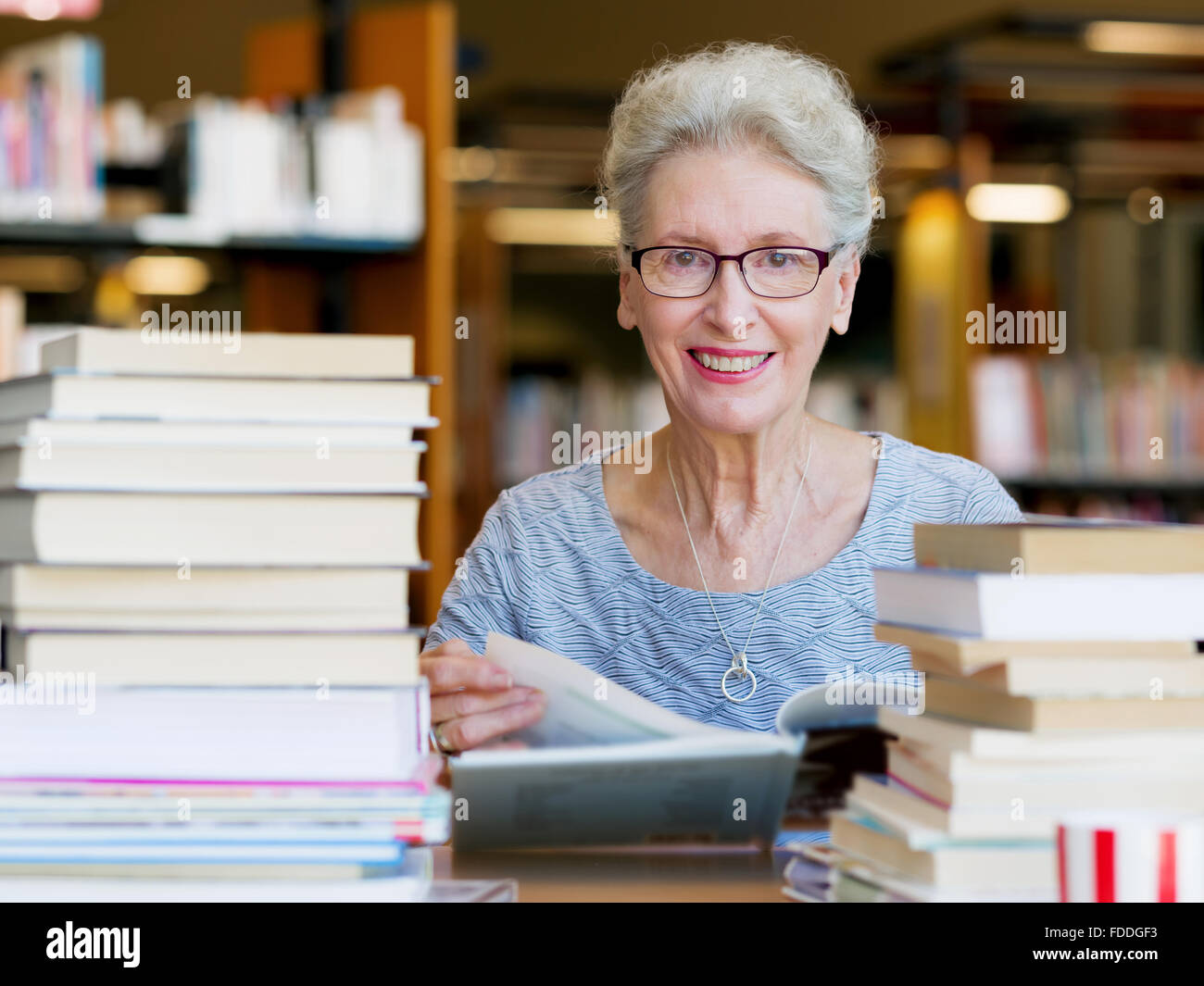 Elderly scholar holding hi-res stock photography and images - Alamy