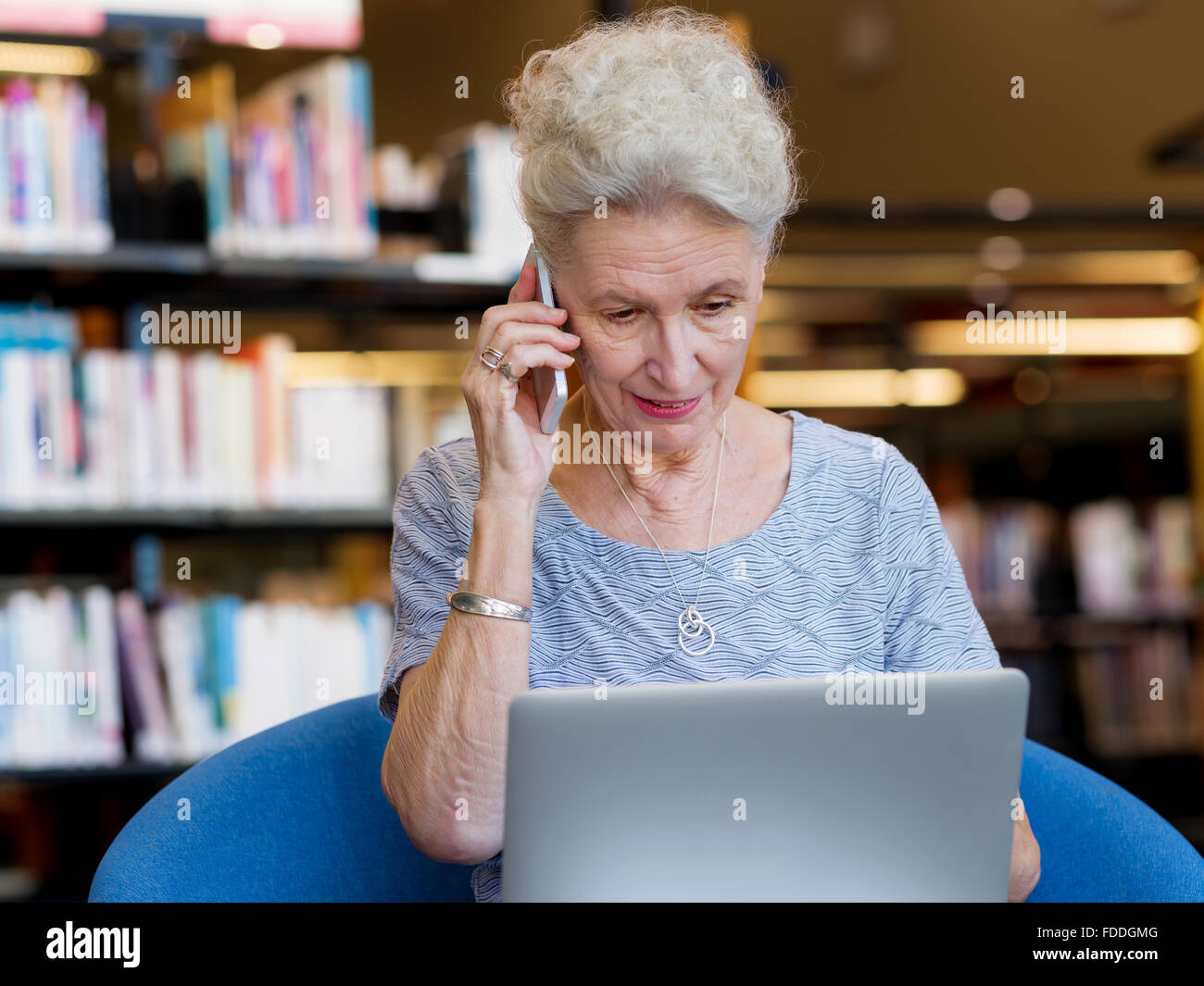Elderly lady working with laptop Stock Photo - Alamy