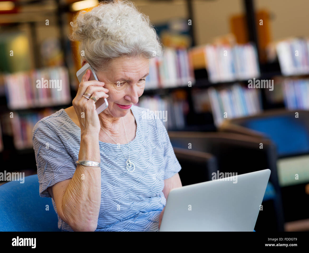 Elderly lady working with laptop Stock Photo - Alamy