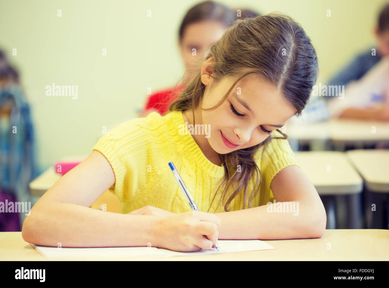 group of school kids writing test in classroom Stock Photo - Alamy