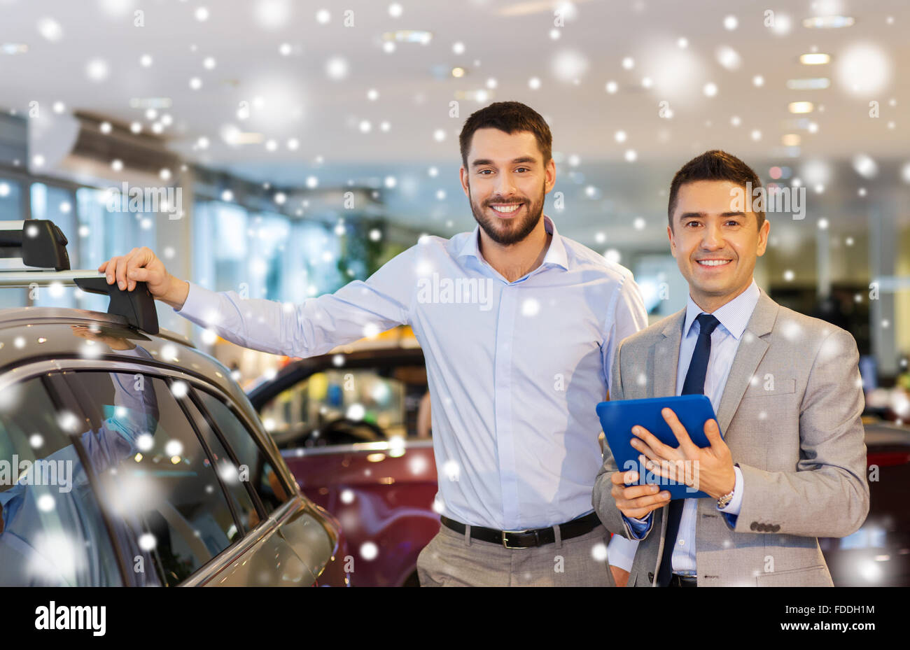 happy man with car dealer in auto show or salon Stock Photo - Alamy