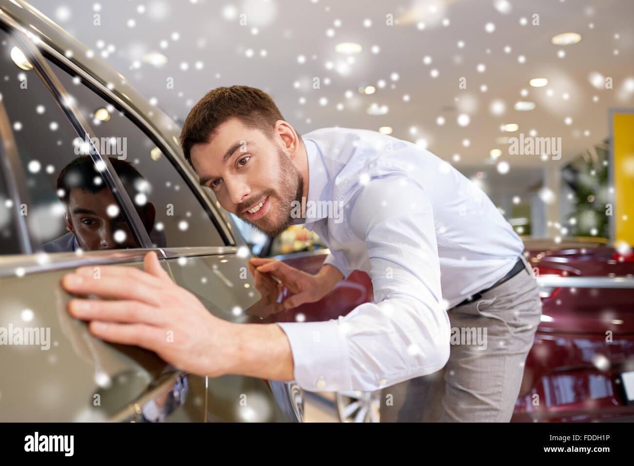 happy man touching car in auto show or salon Stock Photo - Alamy