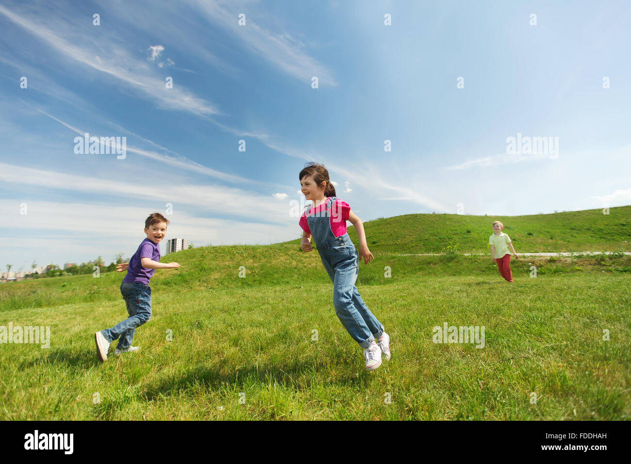 group of happy kids running outdoors Stock Photo - Alamy