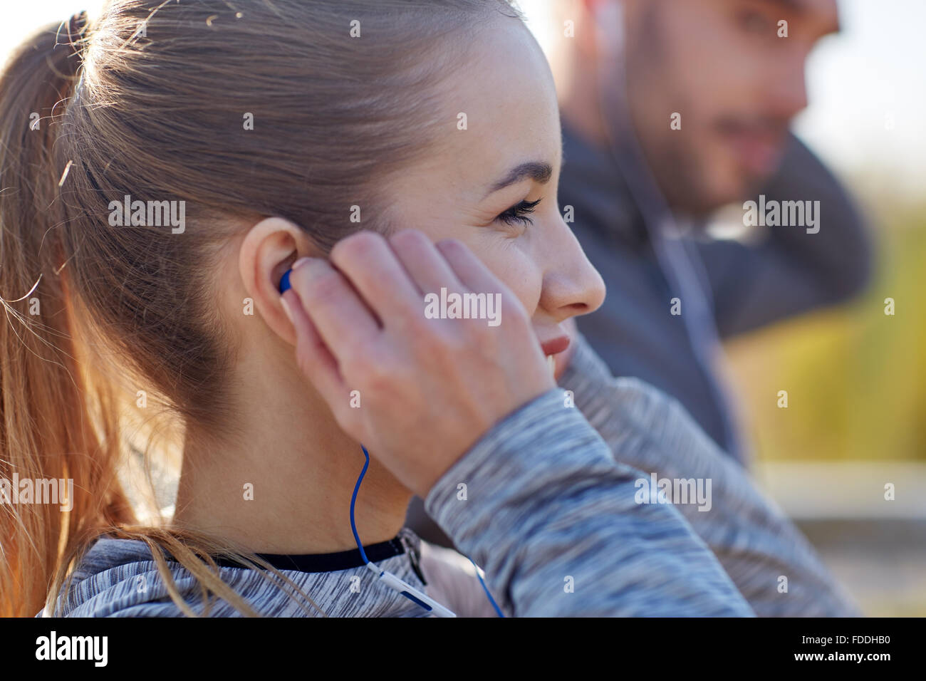 happy woman with earphones listening to music Stock Photo - Alamy
