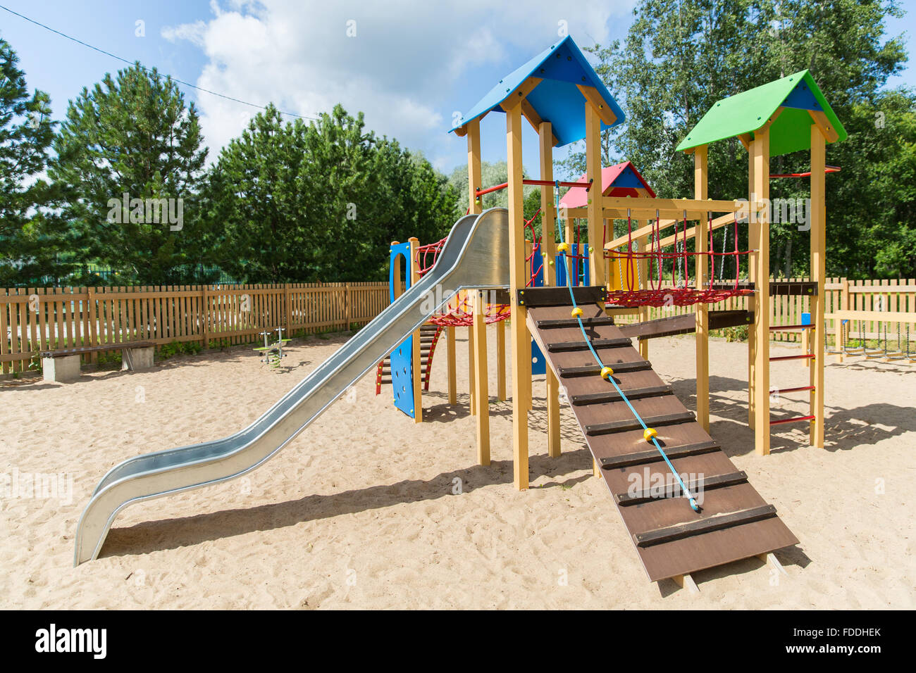 climbing frame with slide on playground at summer Stock Photo - Alamy