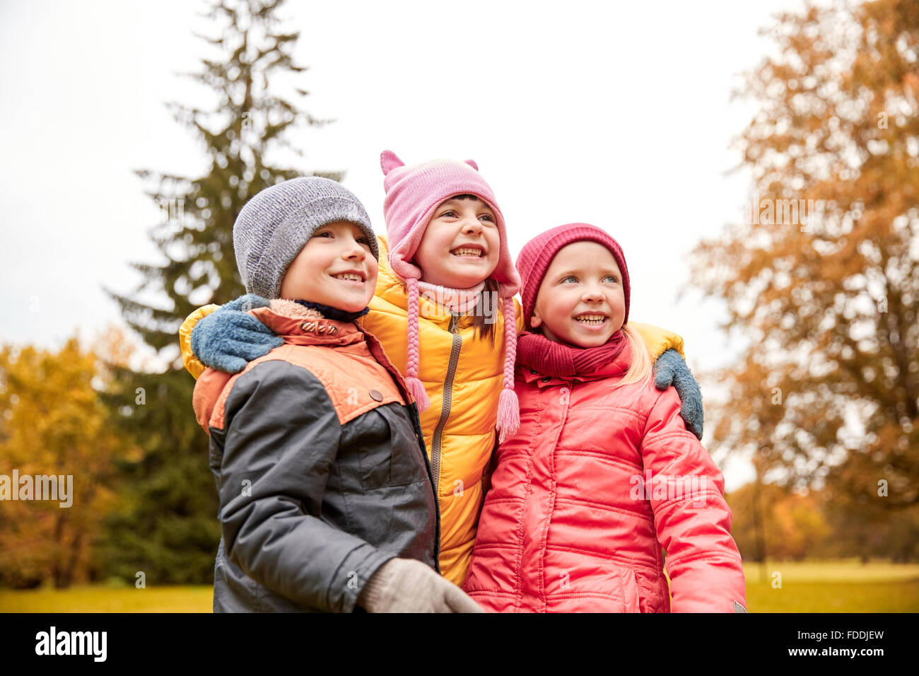 group of happy children hugging in autumn park Stock Photo - Alamy