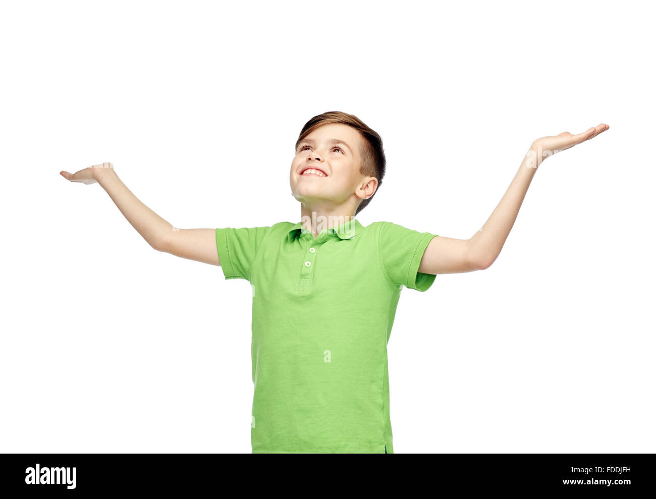 happy boy in polo t-shirt raising hands up Stock Photo - Alamy