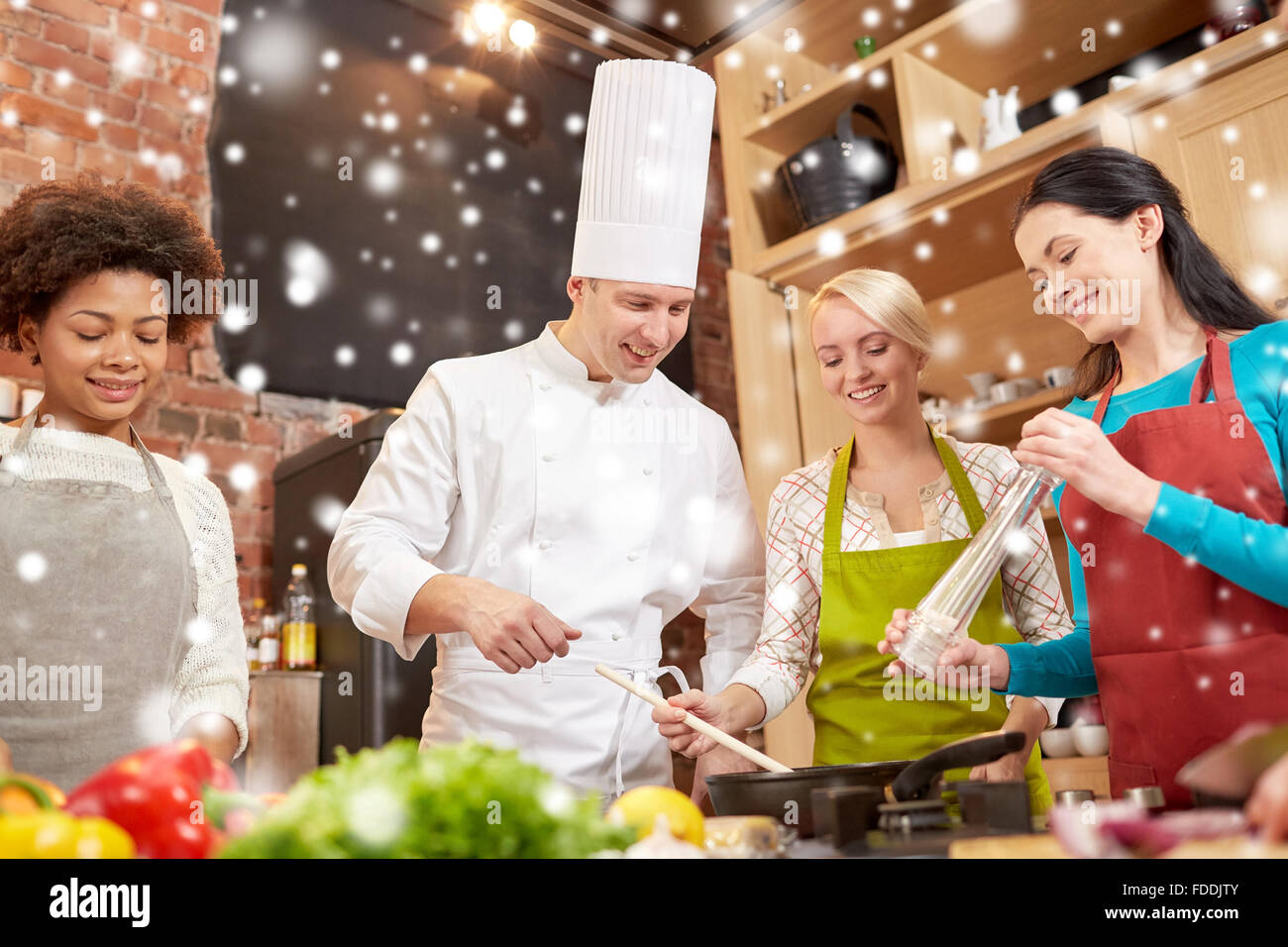 happy women and chef cook cooking in kitchen Stock Photo - Alamy