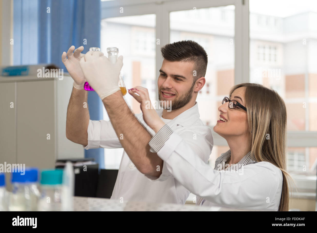 Group Of High School Students Working Together At Laboratory Class ...