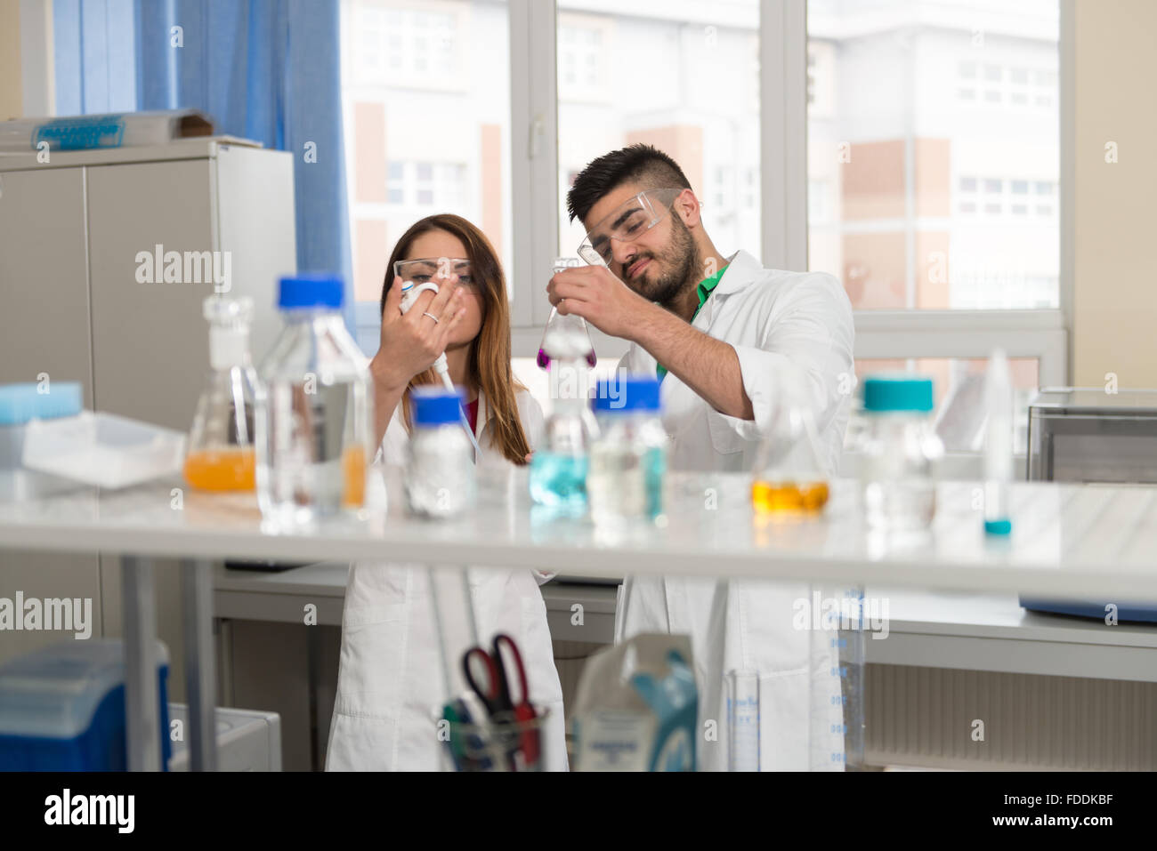Group Of High School Students Working Together At Laboratory Class ...