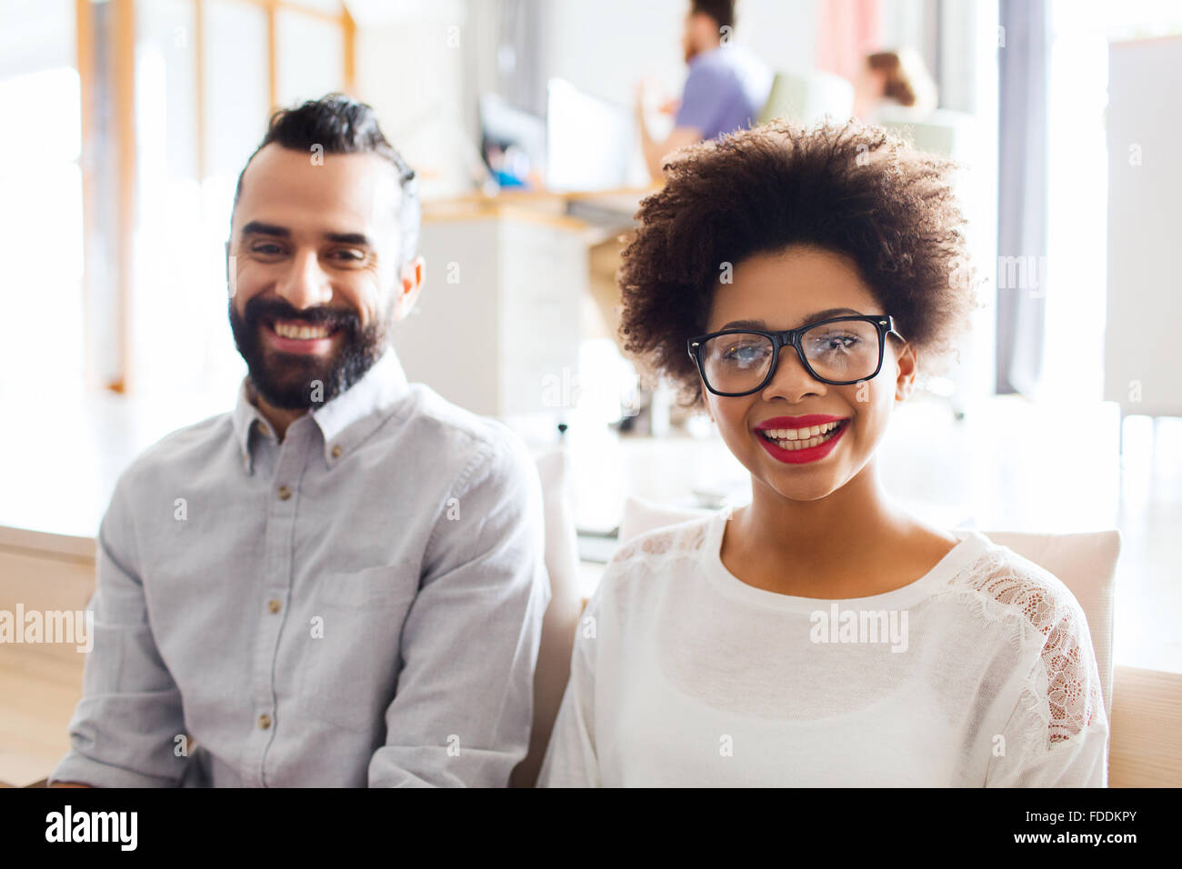 happy creative team in office Stock Photo - Alamy
