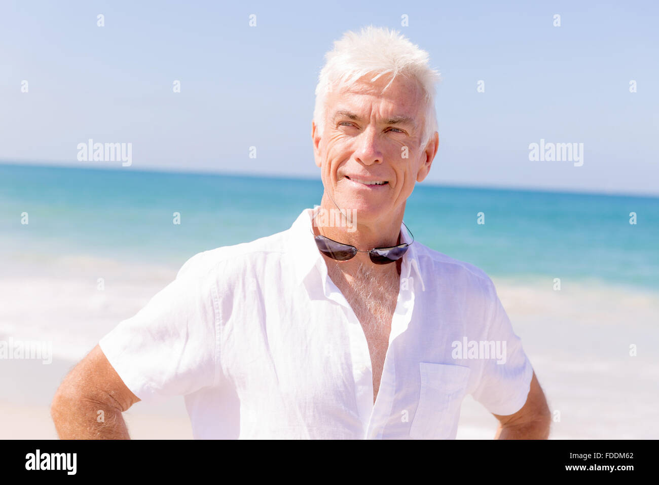 Handsome man on the beach Stock Photo - Alamy
