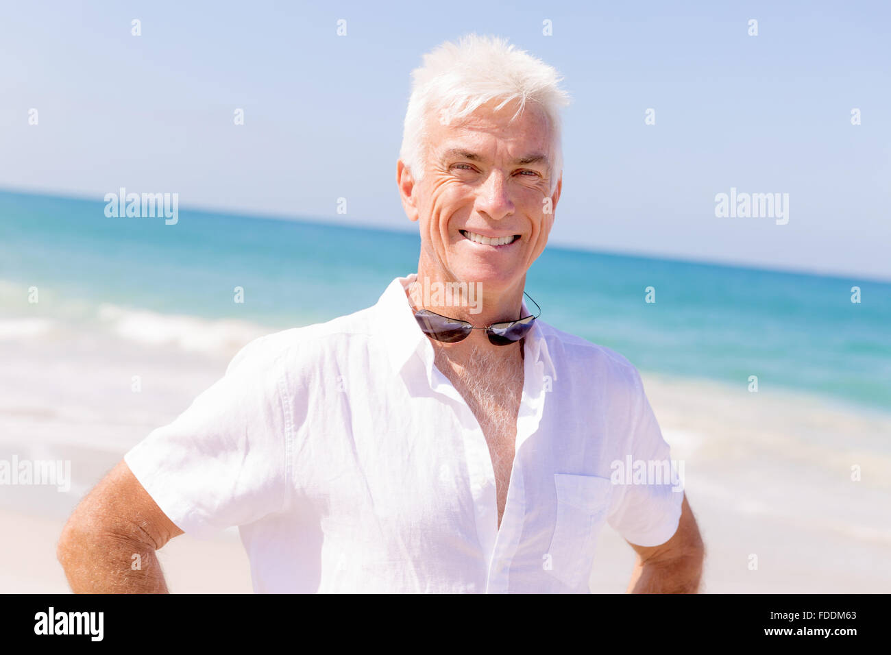Handsome man on the beach Stock Photo - Alamy