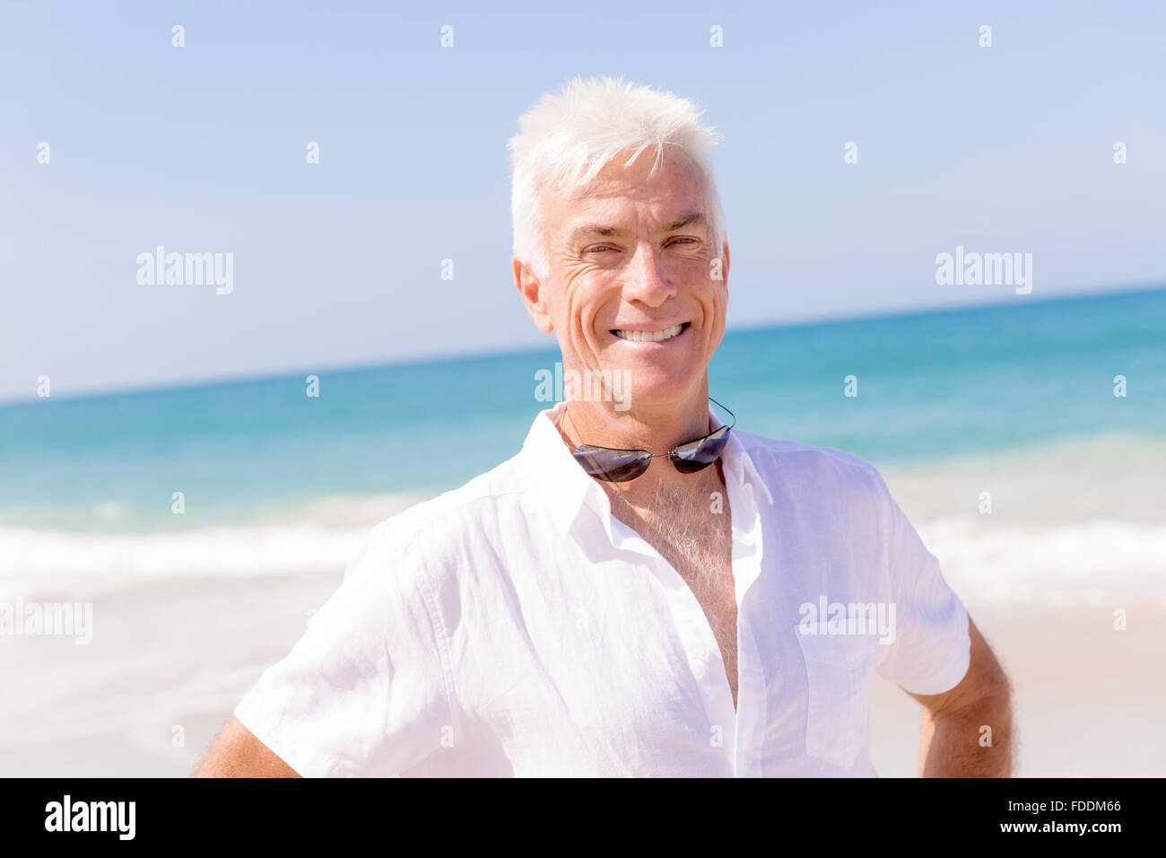 Handsome man on the beach Stock Photo - Alamy