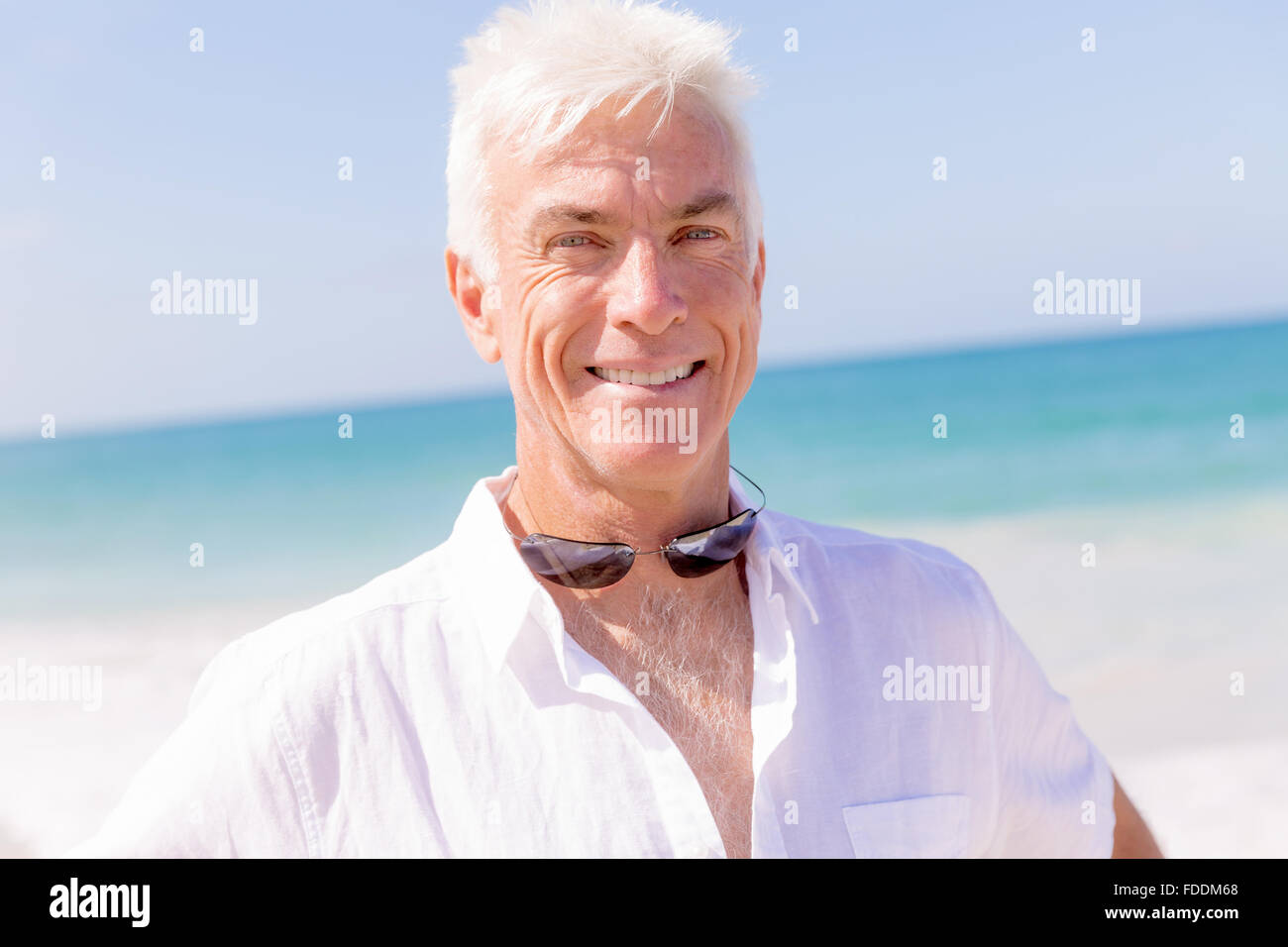 Handsome man on the beach Stock Photo - Alamy