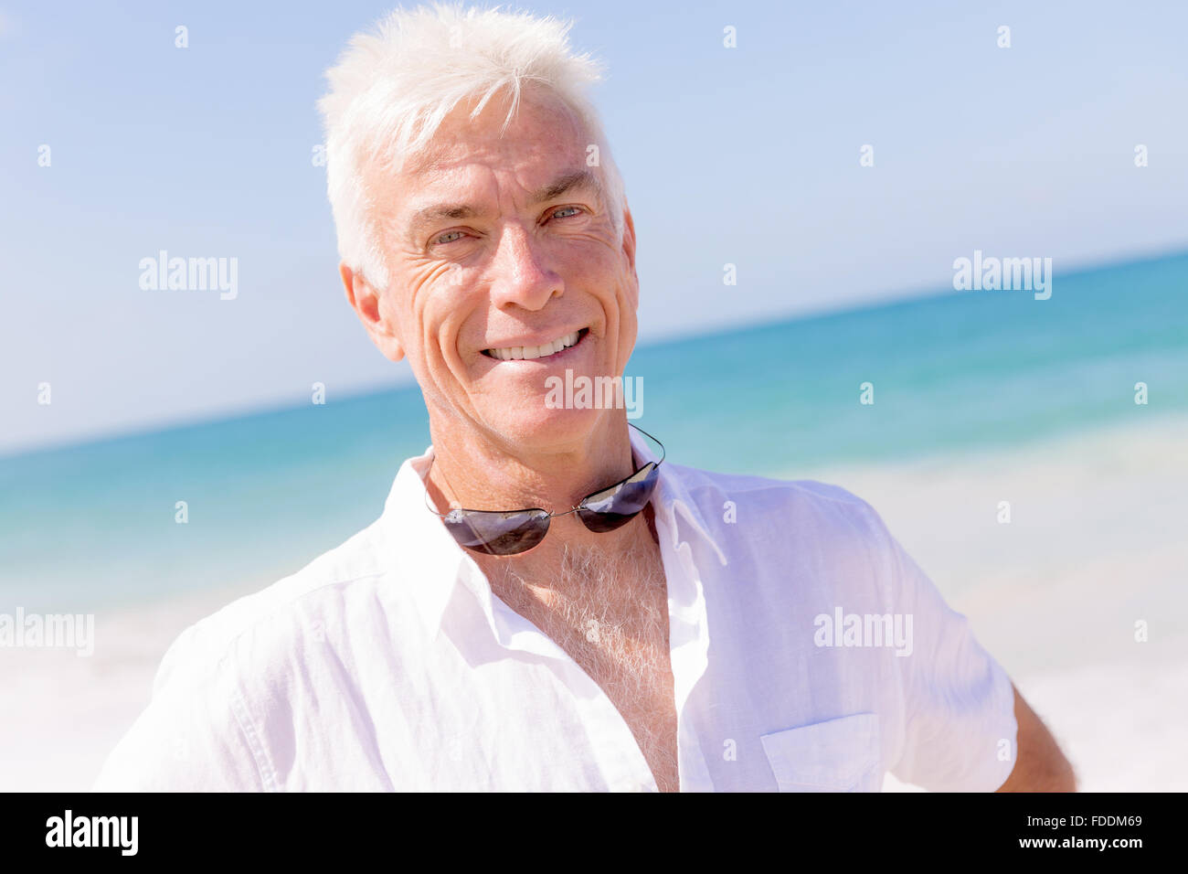 Handsome man on the beach Stock Photo - Alamy