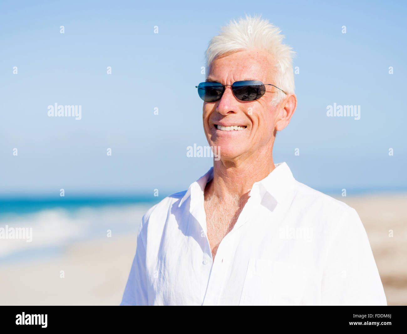 Handsome man on the beach Stock Photo - Alamy