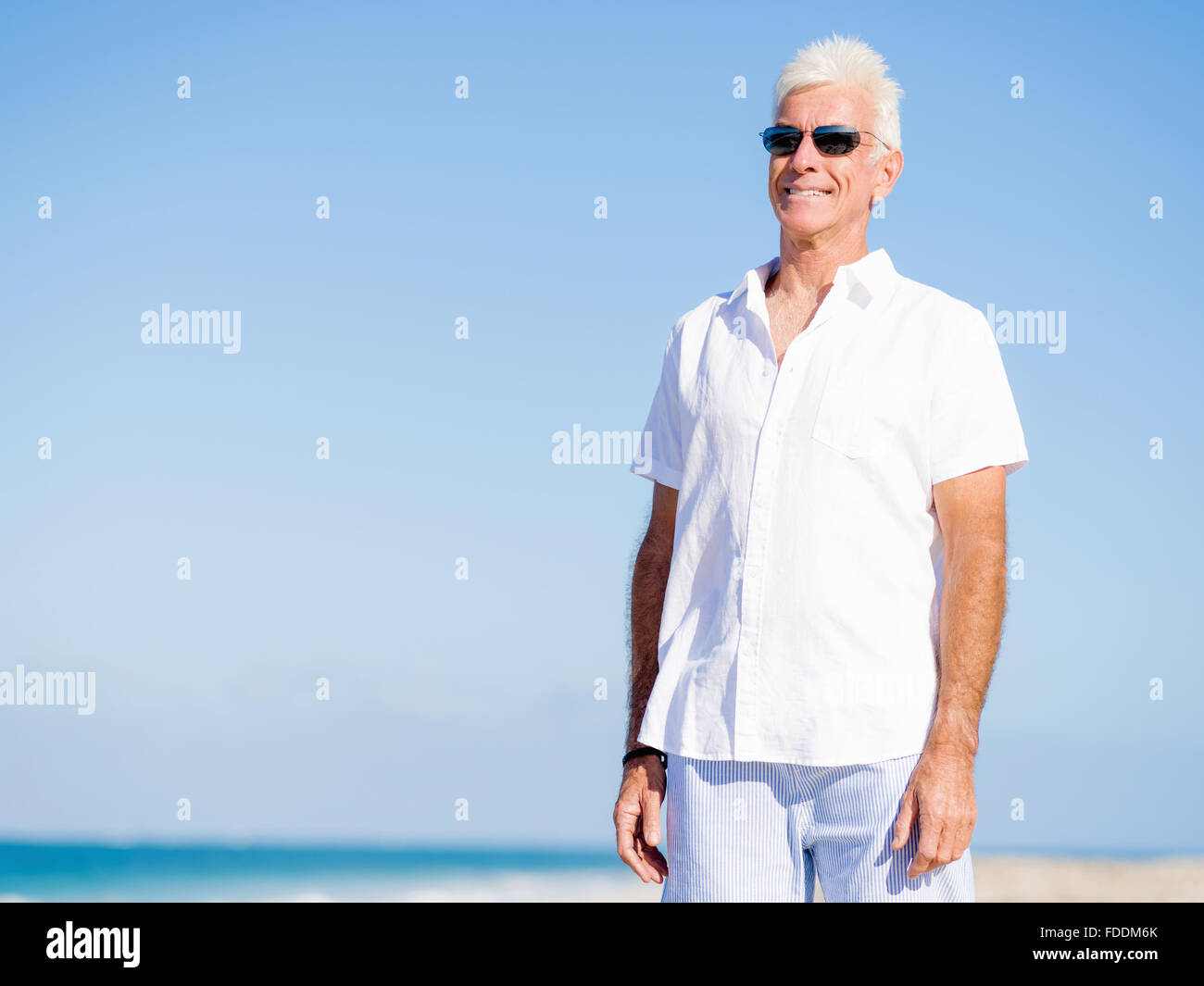 Handsome man on the beach Stock Photo - Alamy