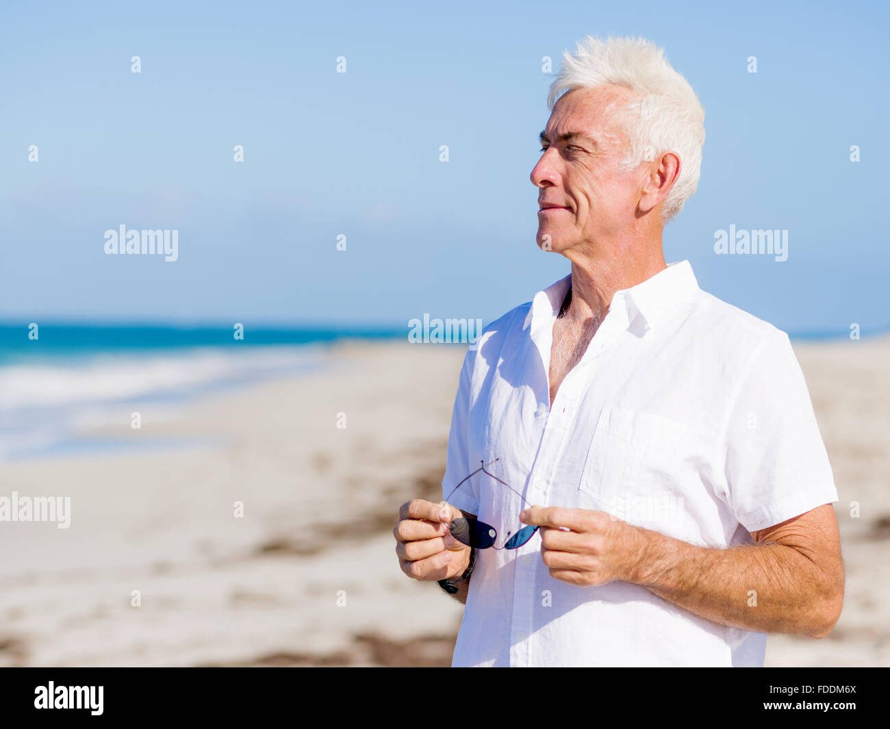 Handsome man on the beach Stock Photo - Alamy