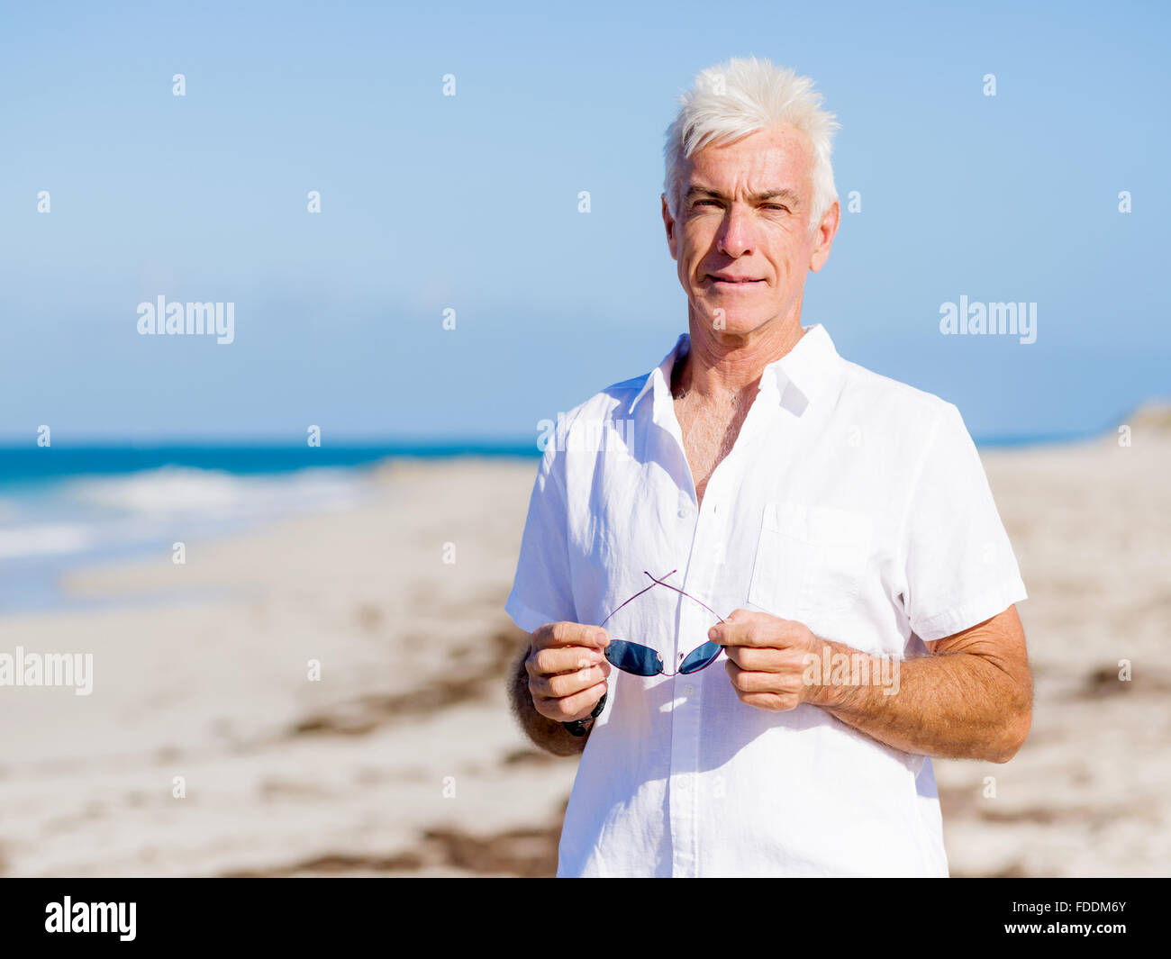 Handsome man on the beach Stock Photo - Alamy