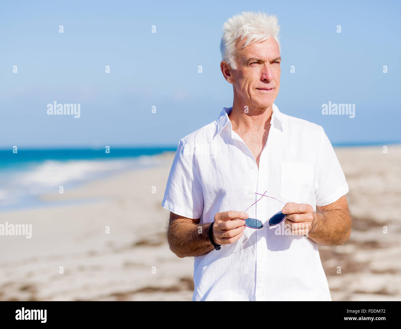 Handsome man on the beach Stock Photo - Alamy
