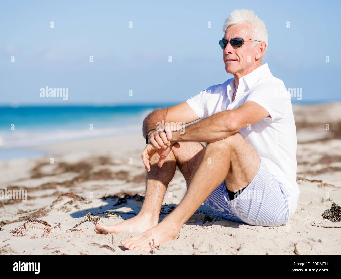 Handsome man on the beach Stock Photo - Alamy