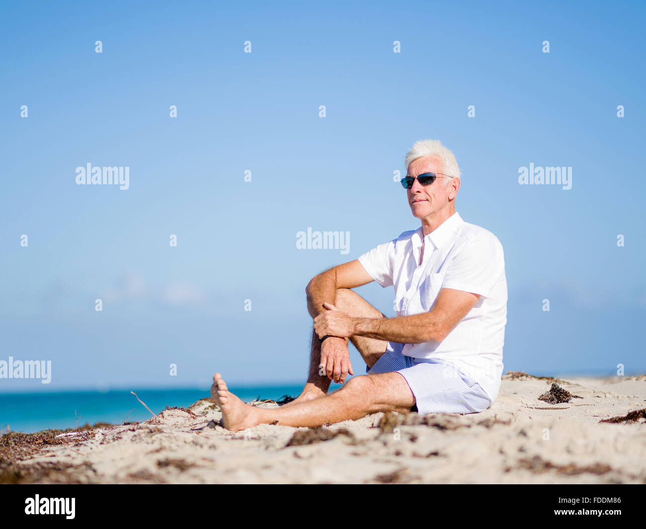 Handsome man on the beach Stock Photo - Alamy