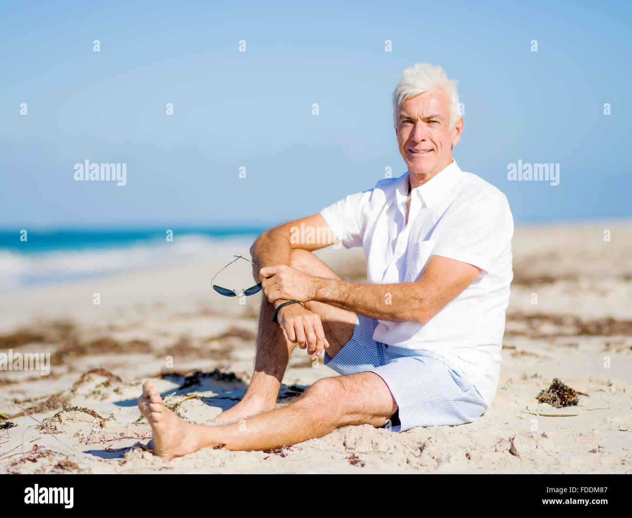 Handsome man on the beach Stock Photo - Alamy