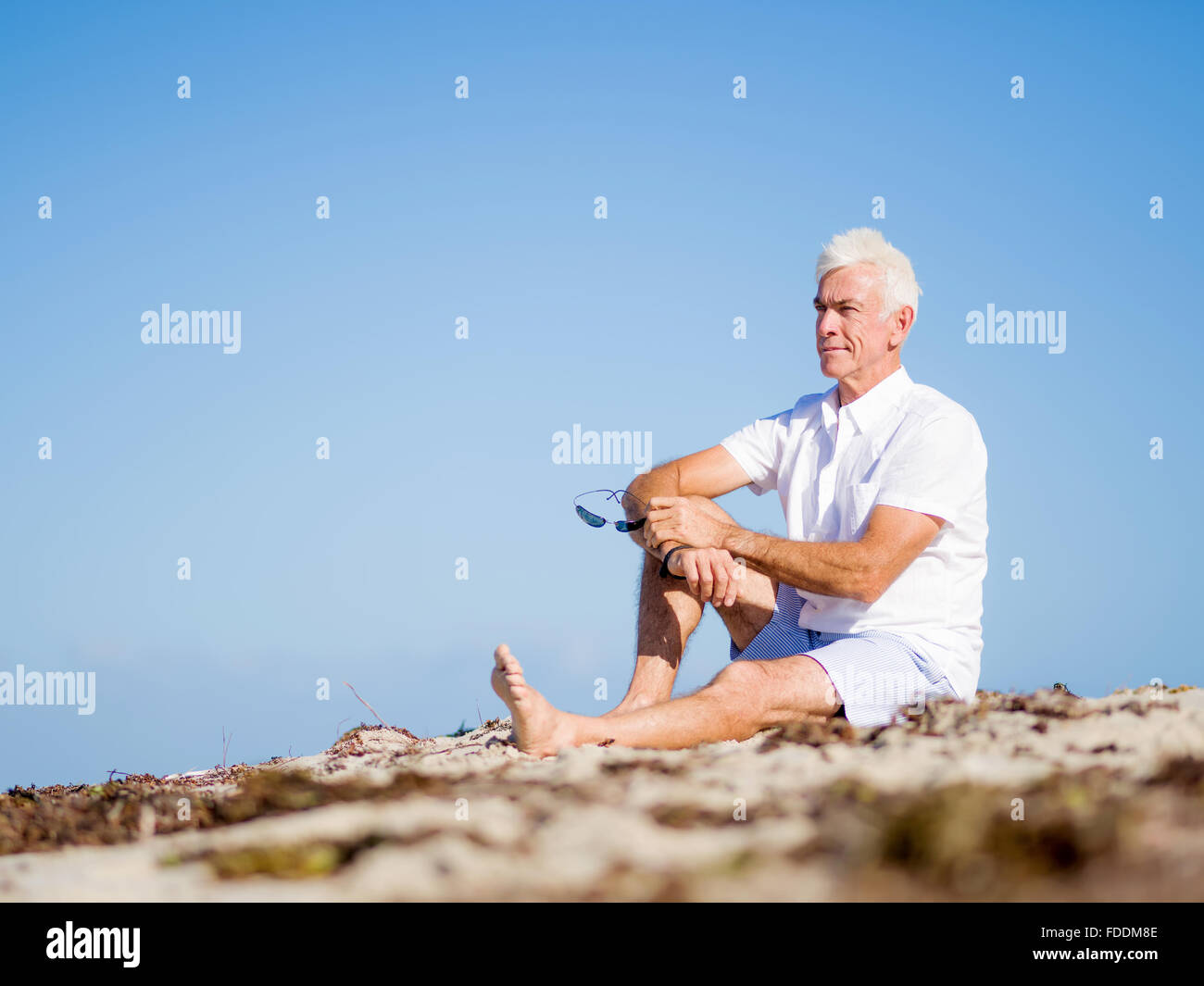 Handsome man on the beach Stock Photo - Alamy