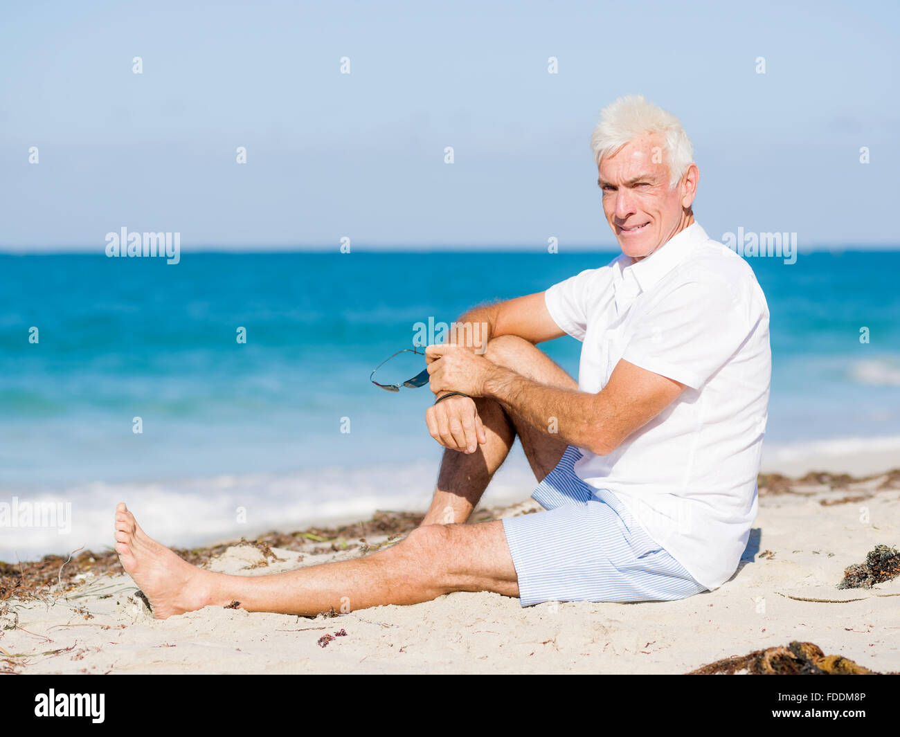 Handsome man on the beach Stock Photo - Alamy