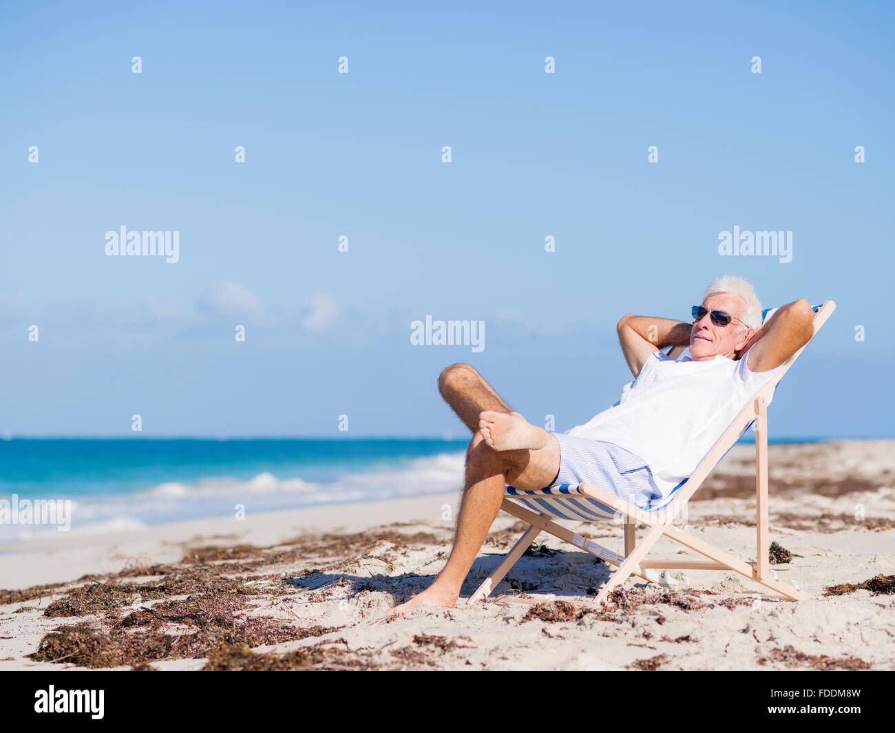 Handsome man on the beach Stock Photo - Alamy