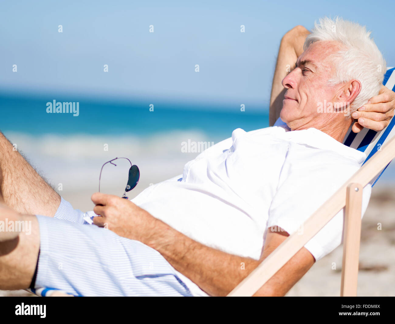 Handsome man on the beach Stock Photo - Alamy