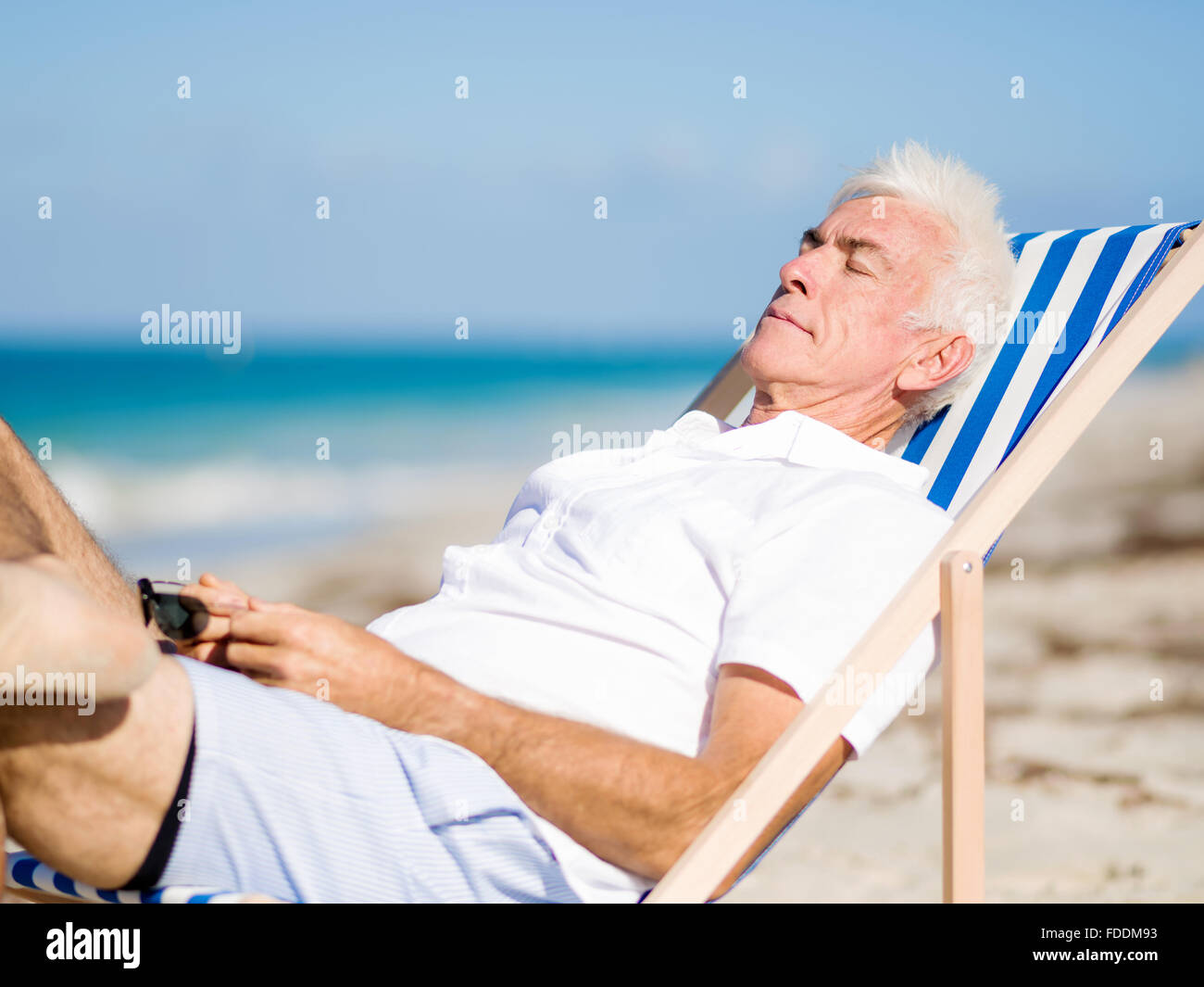 Handsome man on the beach Stock Photo - Alamy