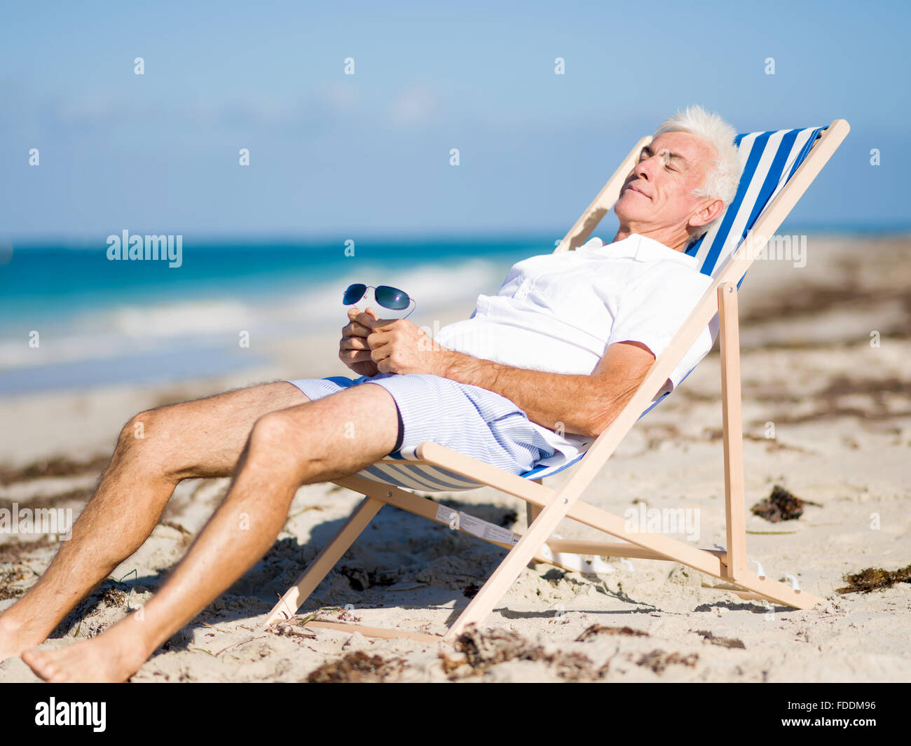 Handsome man on the beach Stock Photo - Alamy