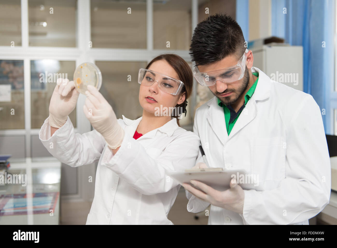 Interracial Team Of Male And Female Medical Or Scientific Researchers ...