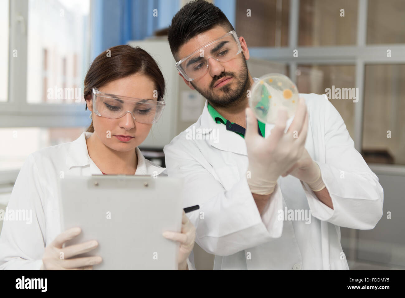 Group Of High School Students Working Together At Laboratory Class ...
