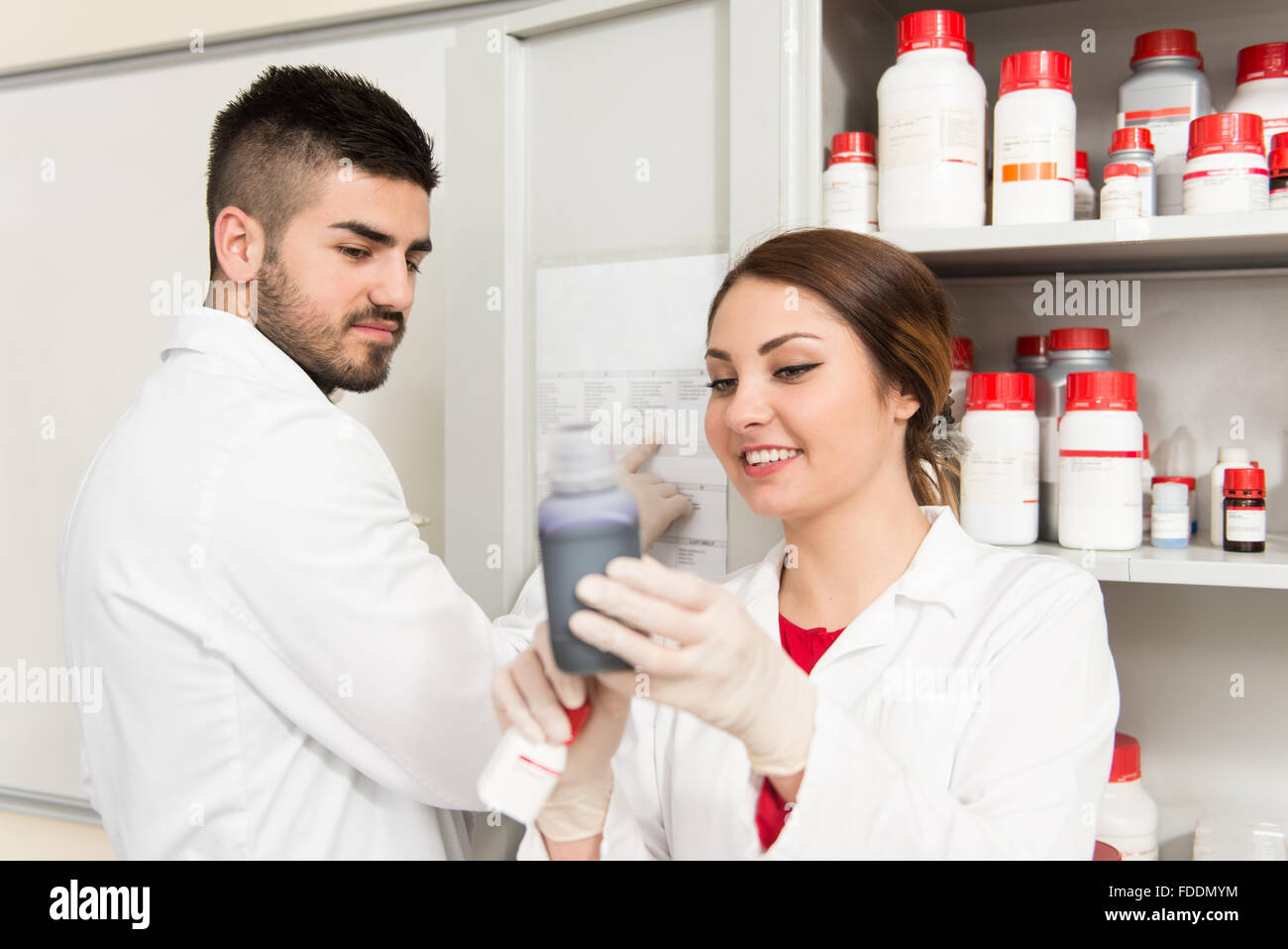 Group Of High School Students Working Together At Laboratory Class ...