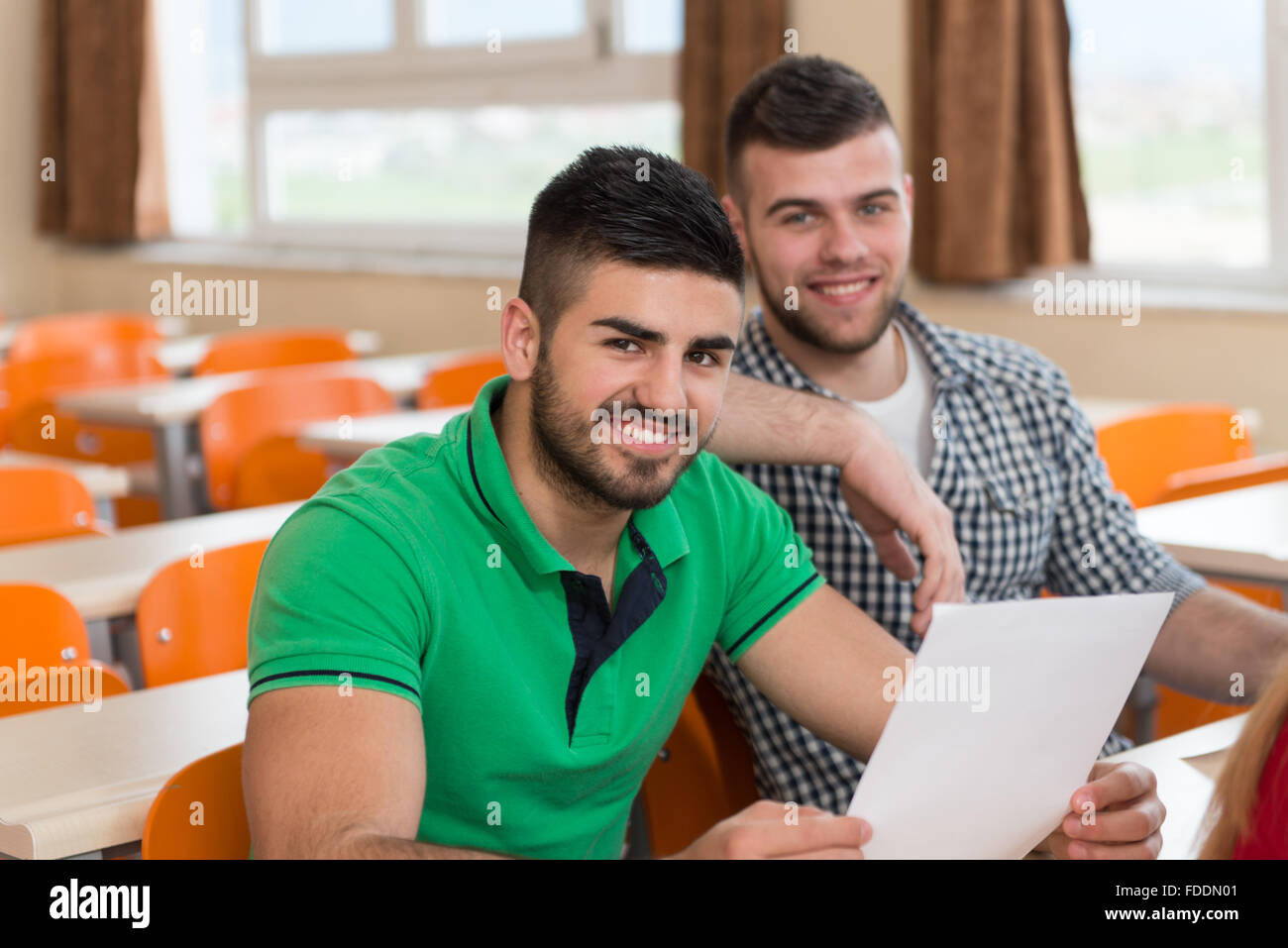 Young Group Of Attractive Teenage Students In A College Classroom ...