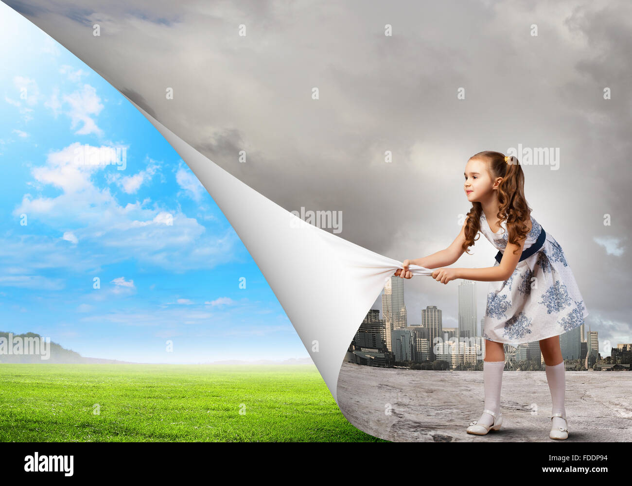 Little girl turning page with another reality Stock Photo - Alamy