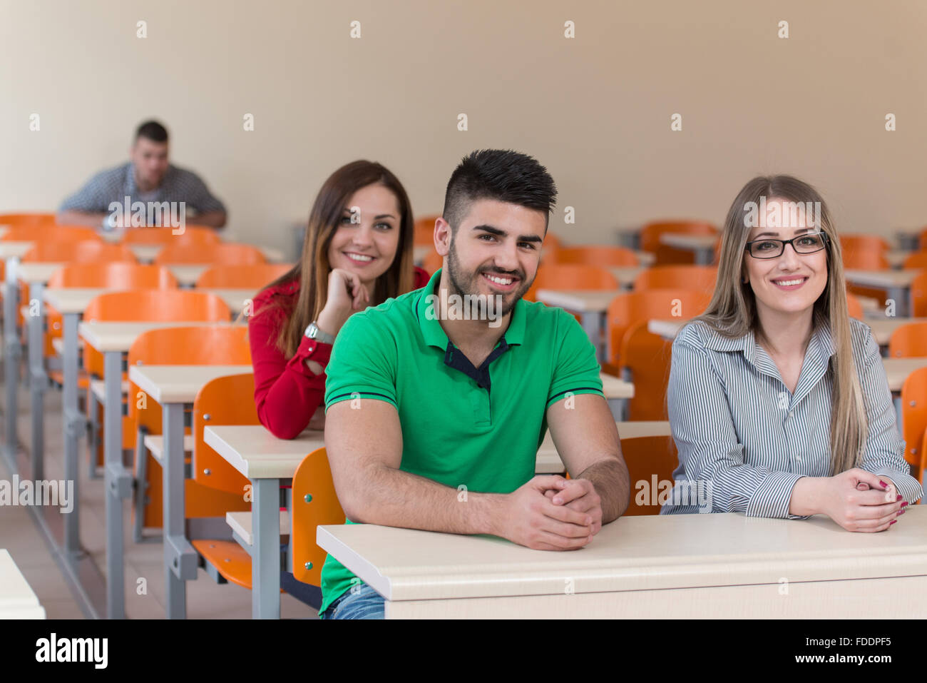 Young Group Of Attractive Teenage Students In A College Classroom ...