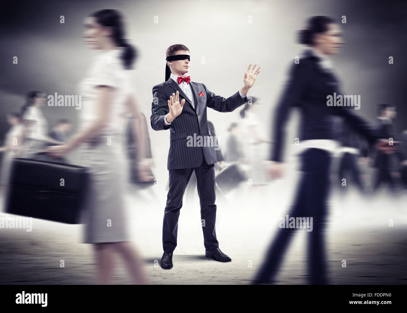 Image of businessman in blindfold walking among group of people Stock ...