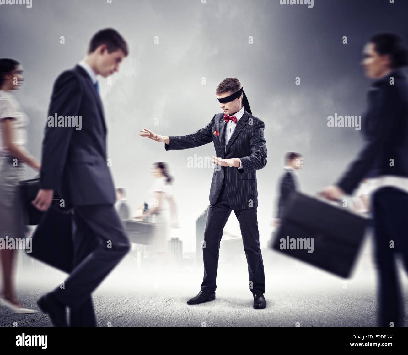 Image of businessman in blindfold walking among group of people Stock ...
