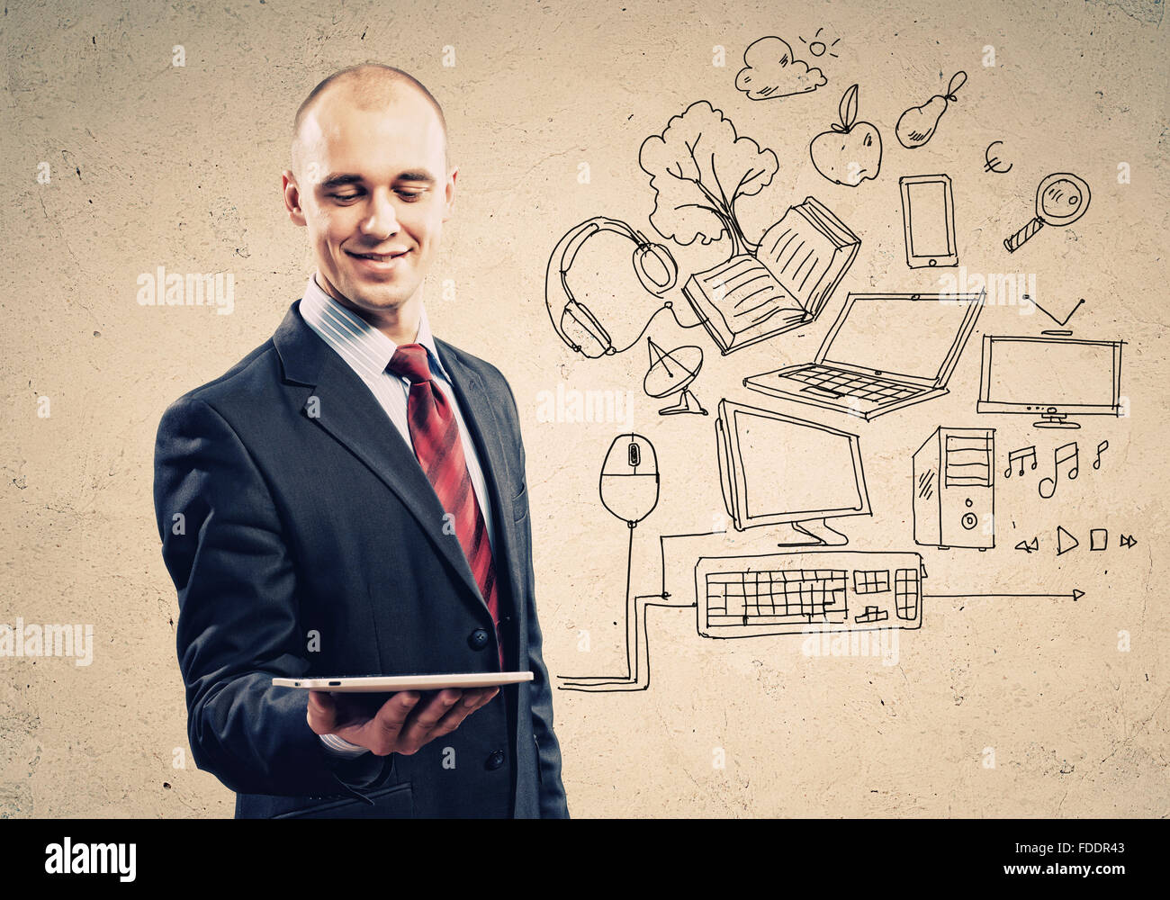 Image of businessman holding ipad. Collage drawings Stock Photo - Alamy