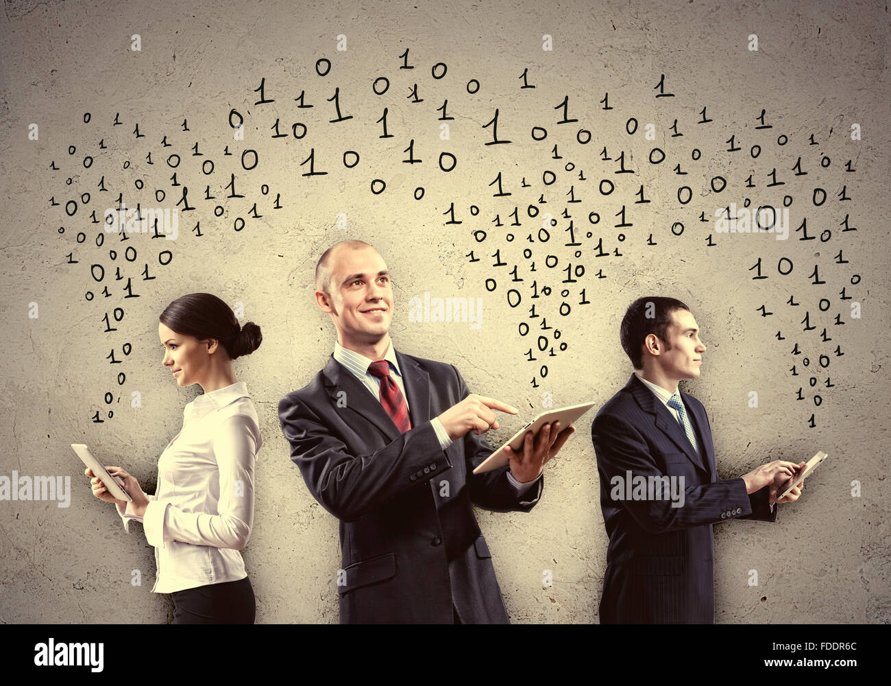 Three young people with tablet pc in hands Stock Photo - Alamy