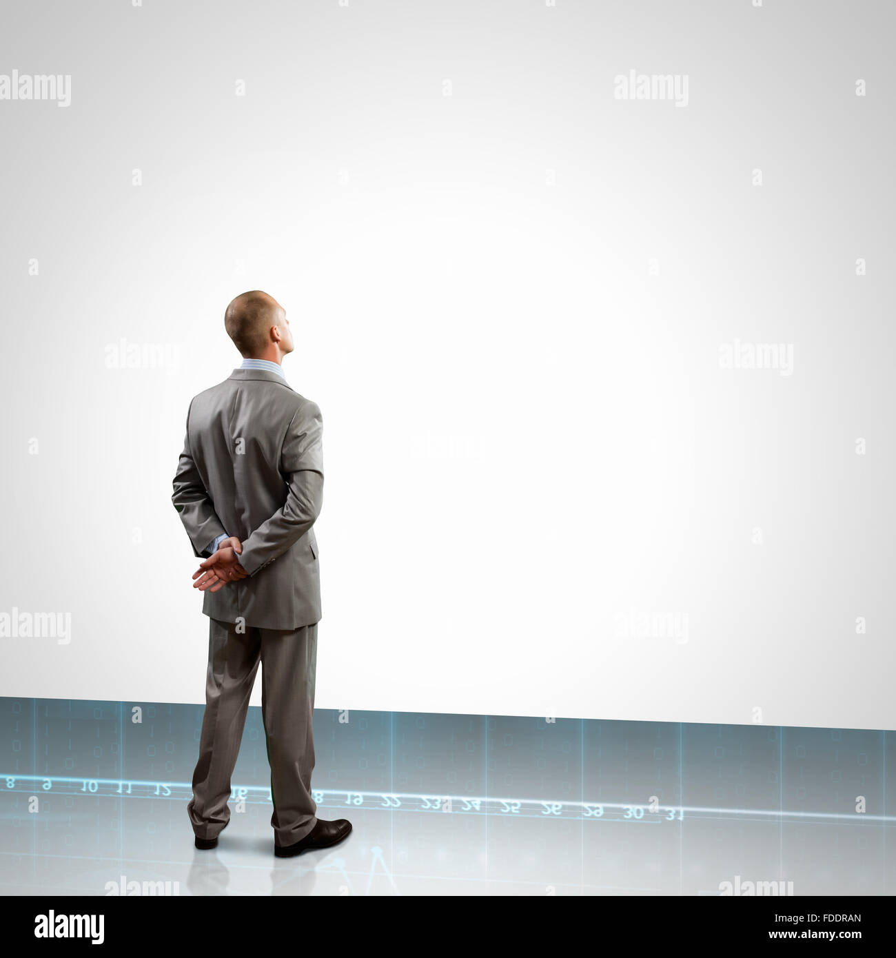 Back view image of businessman with arms crossed behind back. Place for ...